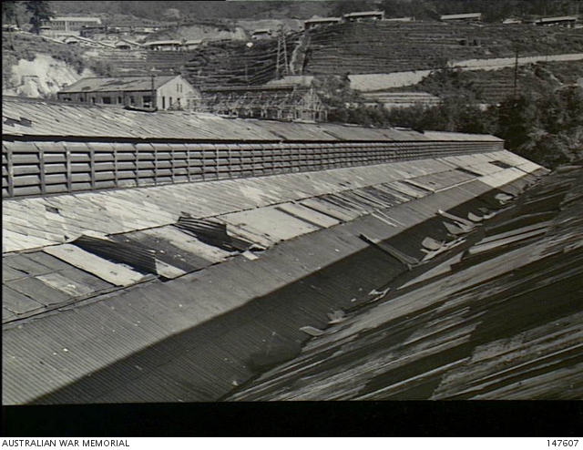 Kure-Hiro Area, Japan. 1951-10-14. Damaged roofs showing the tin ...