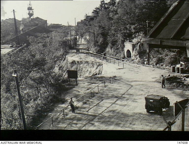 Kure-Hiro Area, Japan. 1951-10-14. A temporary fence erected near a ...