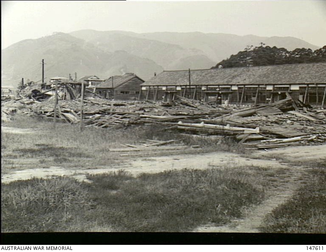 Hiro, Japan. 1951-10-14. The remains of a two storey wooden building ...