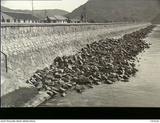 Nijimura, Japan. 1951-10-14. The sea wall surrounding BCOF dependents ...