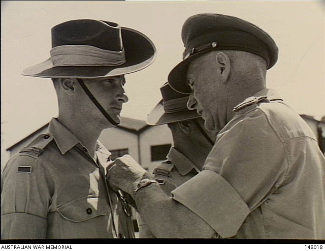 Hiro, Japan. 1952-08-21. 3/400223 Private R. F. A. Smith receiving the ...