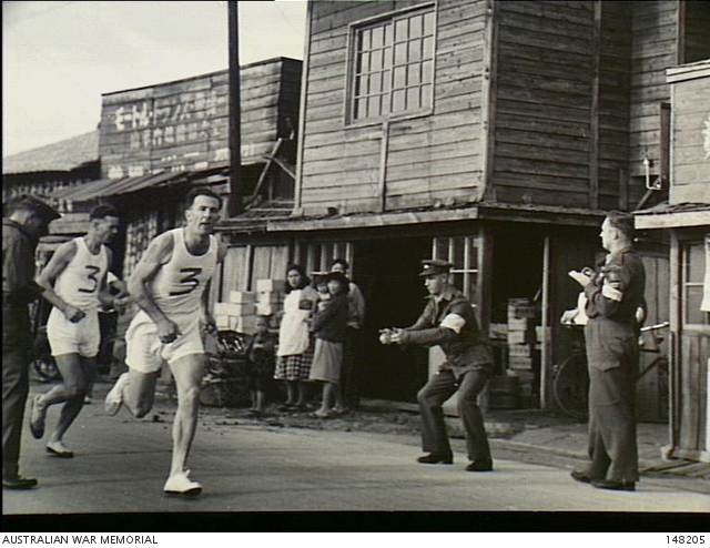 Hiroshima, Japan. 1952-11-19. Signalman R. R. Gibson takes over from ...