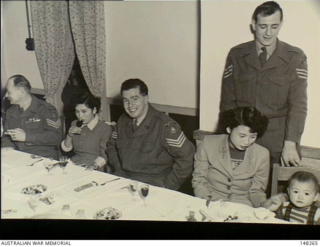 Hiro, Japan. 1952-12-25. Members and friends wait for Christmas dinner ...