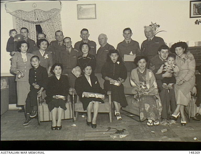 Hiro, Japan. 1952-12-25. A group portrait of soldiers and their ...