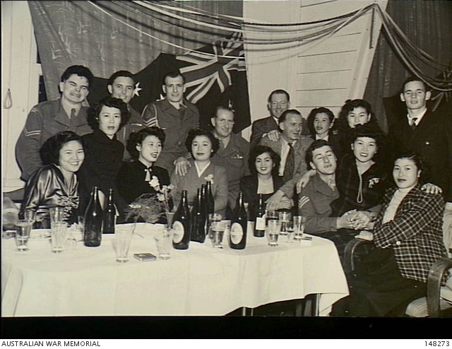 Hiro, Japan. 1952-12-31. A group portrait of soldiers and their ...