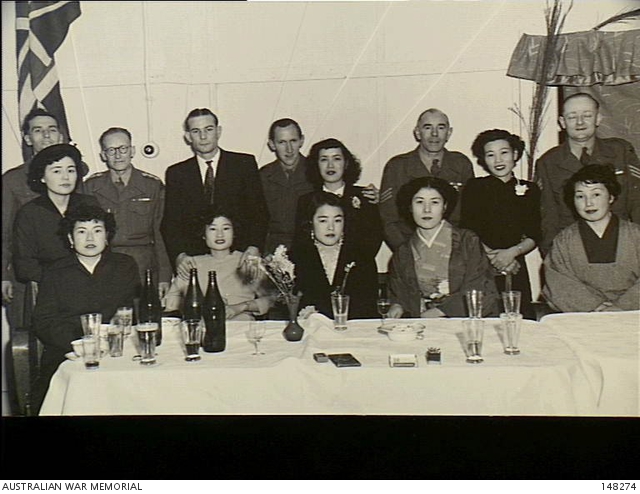 Hiro, Japan. 1952-12-31. A group portrait of soldiers and their ...
