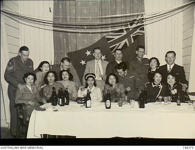 Hiro, Japan. 1952-12-31. A group portrait of soldiers and their ...