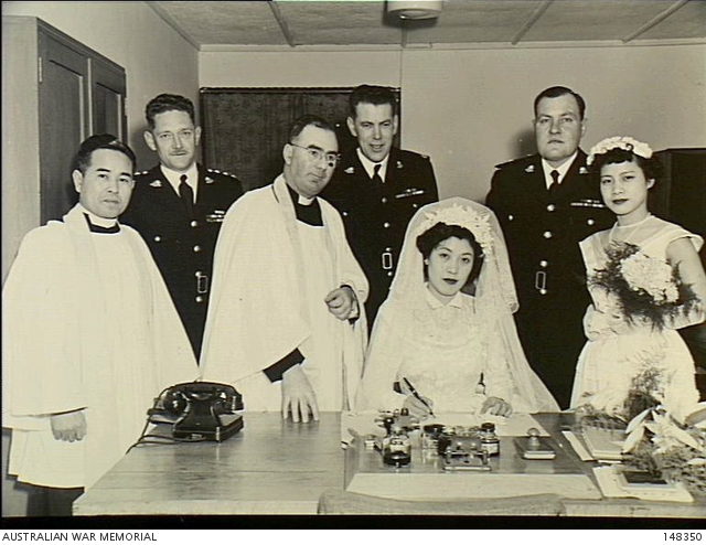 Kure, Japan. 1953-02-25. Japanese bride signing the marriage register ...