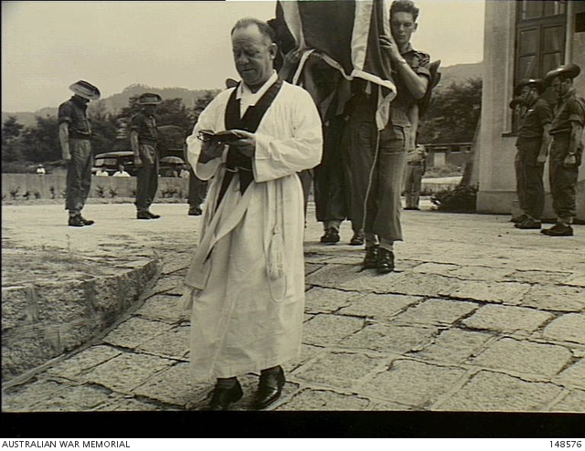 Kure, Japan. 1953-08-18. Padre Reed leads the funeral procession from ...