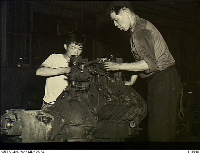 Kure, Japan. 1953-09. Japanese civilian employees working as fitters on ...