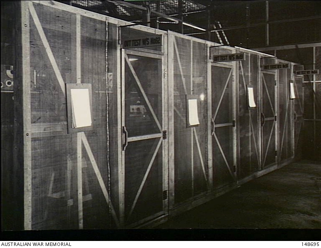 Kure, Japan. 1953-09. Screened test cages where technicians calibrate ...