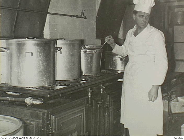 Australia. 1942. A US Army cook preparing a meal at a US camp. Gas ...