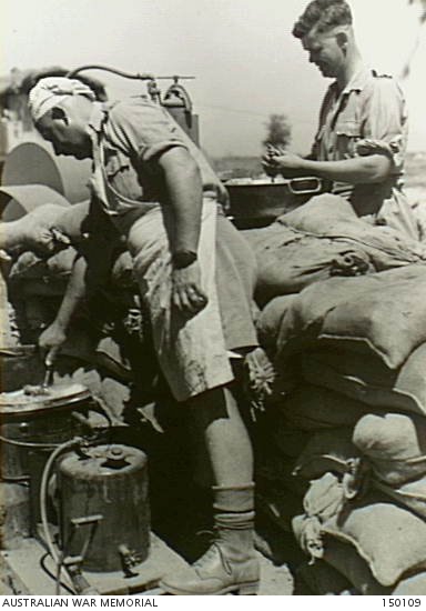 Army cooks have to be resourceful and flexible. A meal is prepared on a ...