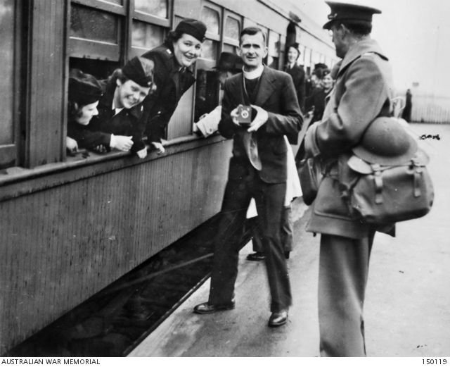 Presbyterian clergyman Hector Harrison prepares to take a photograph at ...