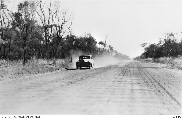 Northern Territory, Australia. July 1942. A car moves along the Alice ...