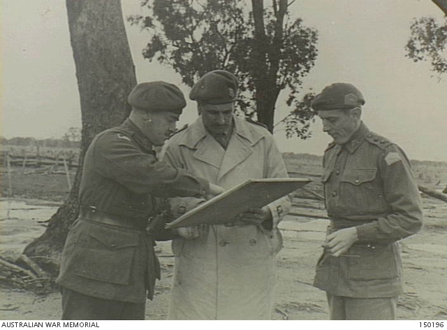 Puckapunyal, Victoria. June 1942. Discussion among members of the ...