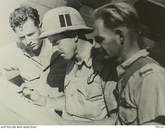Darwin, NT. August 1942. Members of an RAAF aircrew plan their course ...