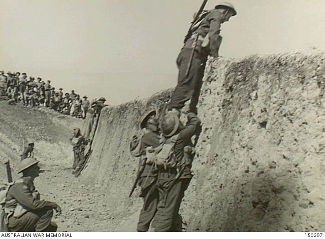 Australian troops, with full gear, negotiate a difficult infantry ...
