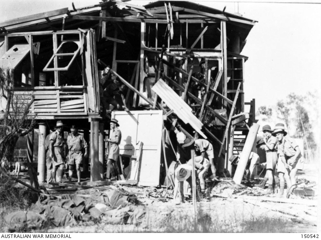Darwin, NT. August 1942. Australian troops inspect damage to a house as ...