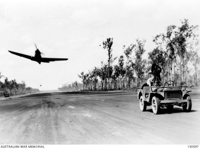 Darwin, NT. A US cameraman in a jeep records a simulated low level ...