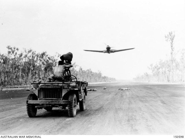 Darwin, NT. A US cameraman in a jeep records a simulated low level ...