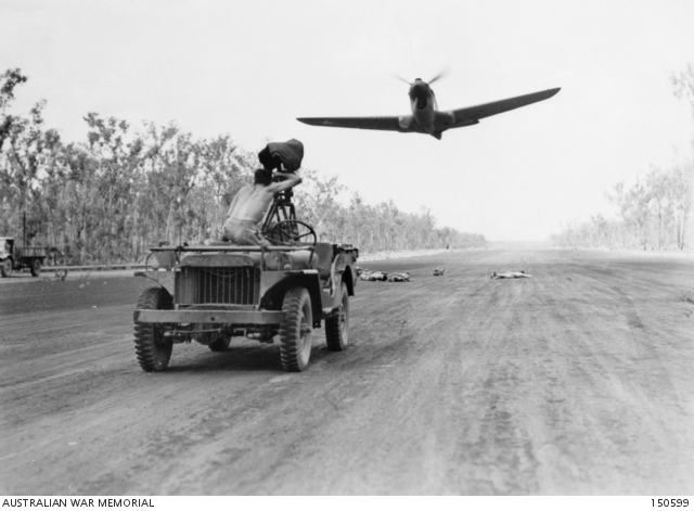 Darwin, NT. A US cameraman in a jeep records a simulated low level ...