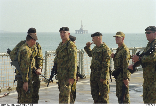 Members of 2nd Cavalry Regiment (2 Cav Regt) on deck of HMAS Tobruk ...