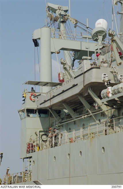 The heavy lift equipment on HMAS Tobruk. The ship is being loaded prior ...