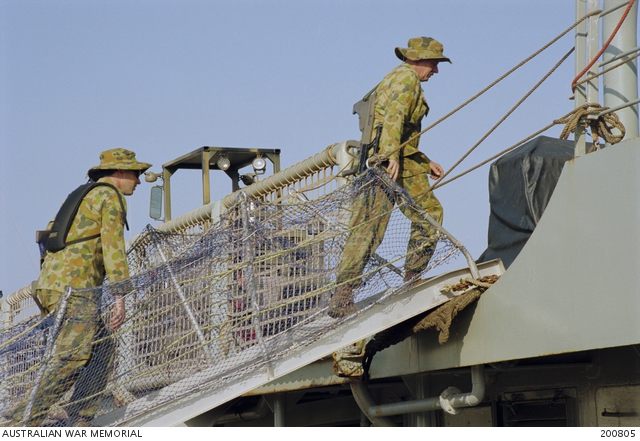 Australian troops boarding HMAS Tobruk prior to departure for East ...