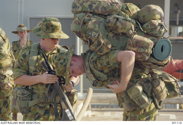 Members of the 3rd Combat Engineer Regiment (3CER) prepare to board ...