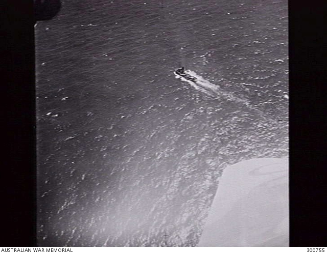 HORN ISLAND, QLD. 1943-09-09. AERIAL PORT QUARTER VIEW OF THE TUG HMAS ...