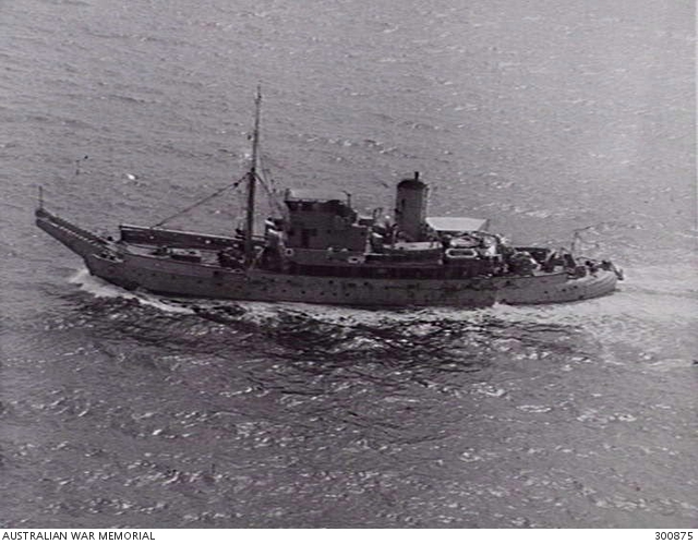 1954-11. AERIAL PORT BEAM VIEW OF THE BOOM DEFENCE VESSEL HMAS KARANGI ...