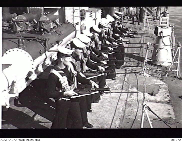 Crew members of the destroyer HMAS Napier undergoing weapon drill on ...