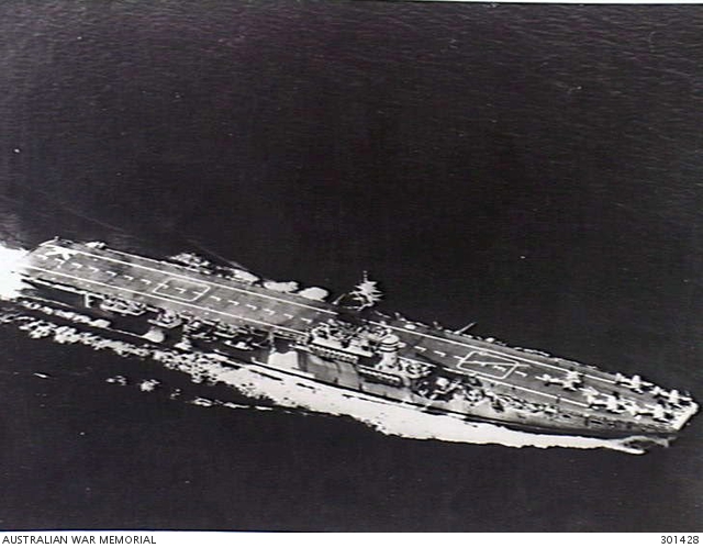 1951. AERIAL STARBOARD SIDE VIEW OF THE AIRCRAFT CARRIER HMAS SYDNEY ...