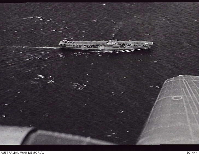 1949-09. AERIAL VIEW STARBOARD SIDE OF THE AIRCRAFT CARRIER HMAS SYDNEY ...