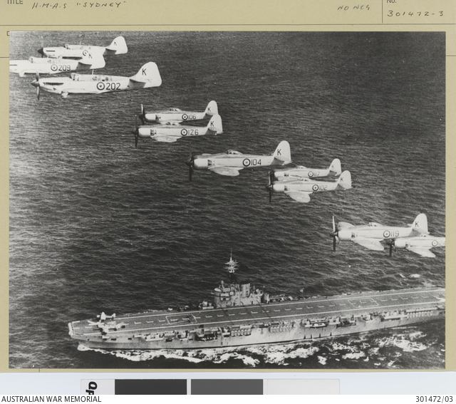 C.1950. AERIAL VIEW OF THE PORT SIDE OF THE AIRCRAFT CARRIER HMAS ...