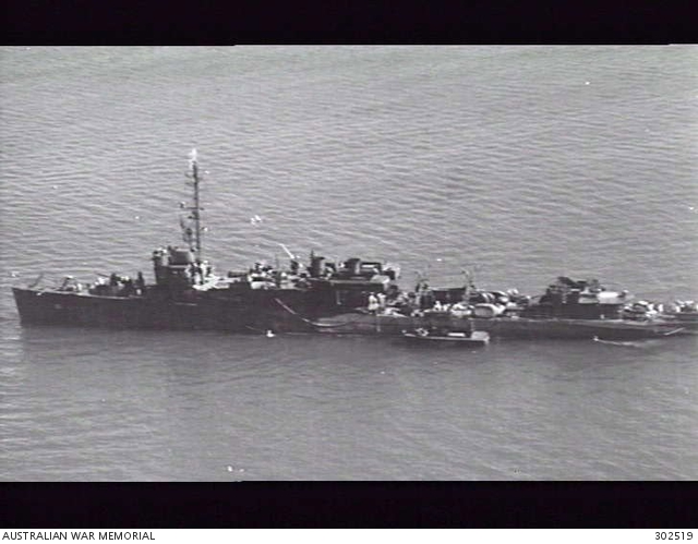 TOWNSVILLE, QLD. 1943-06-18. AERIAL PORT SIDE VIEW OF THE TRANSPORT USS ...