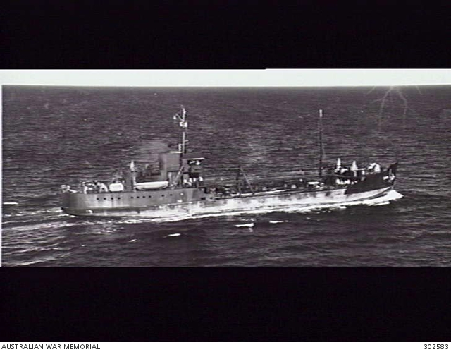 AERIAL STARBOARD SIDE VIEW OF THE US NAVY FUEL OIL BARGE YO 59. TWO ...