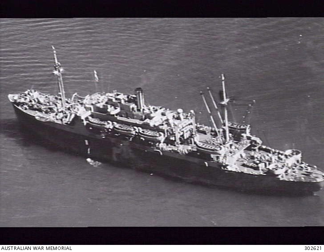 AERIAL PORT SIDE VIEW OF THE US ARMY TRANSPORT HENRY T. GIBBONS. SHE IS ...
