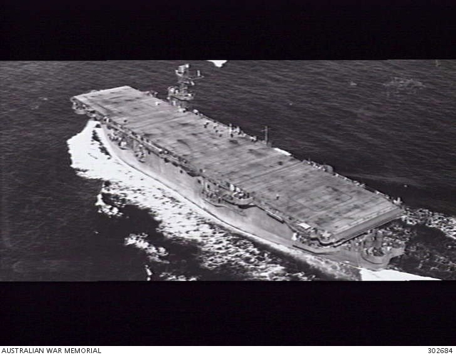 1943-07-02. AERIAL PORT QUARTER VIEW OF THE ESCORT CARRIER USS NASSAU ...