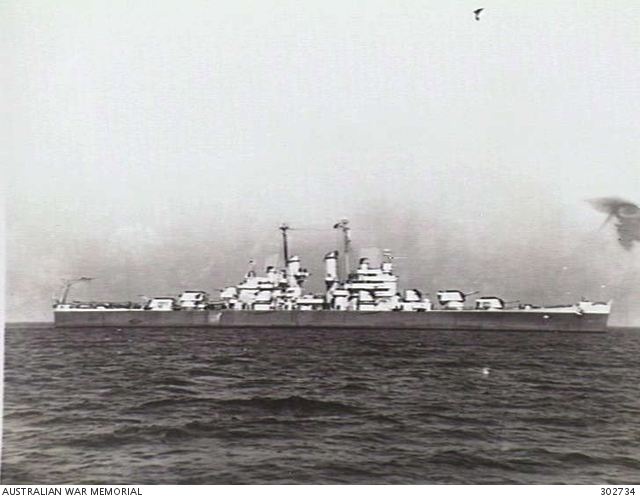 Starboard broadside view of the cruiser USS Santa Fe. The censor has ...