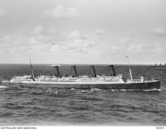 1940-05-05. AERIAL STARBOARD SIDE VIEW OF THE TRANSPORT RMS AQUITANIA ...