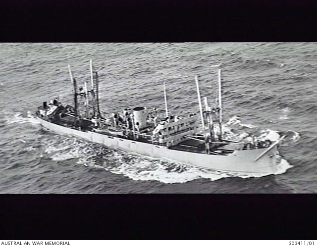 1944-06-20. OVERHEAD VIEW OF THE BRITISH CARGO VESSEL MV HUGHLI. NOTE ...