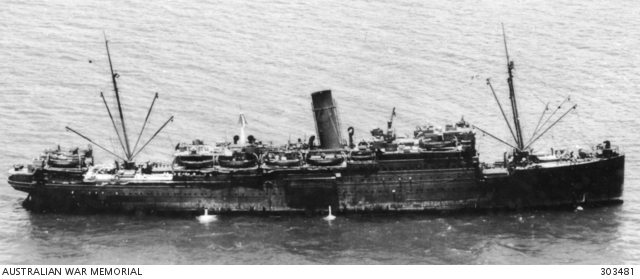 1944-02-07. AERIAL STARBOARD SIDE VIEW OF THE AUSTRALIAN CARGO VESSEL ...