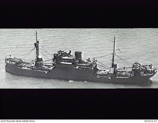 1944-01-13. AERIAL PORT SIDE VIEW OF THE AMERICAN CARGO VESSEL SS LAKE ...