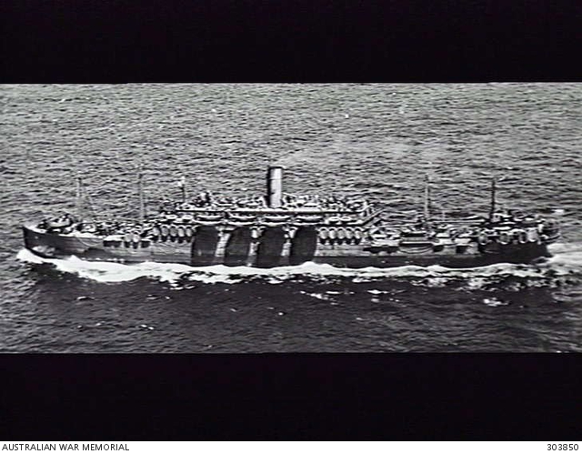 1943-12-24. AERIAL PORT SIDE VIEW OF THE TRANSPORT USS REPUBLIC (AP-33 ...