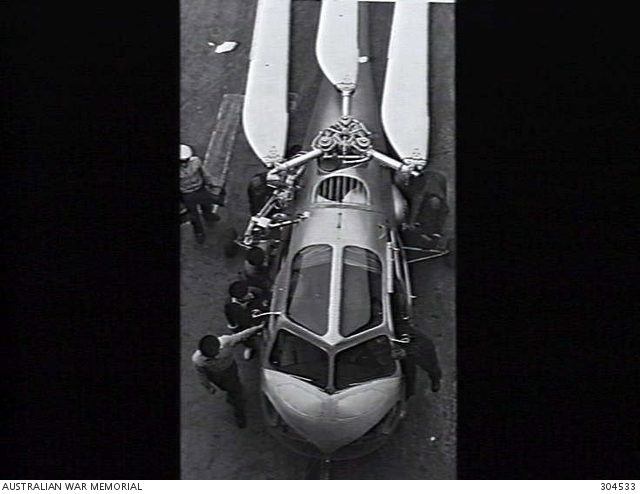 C.1954. OVERHEAD VIEW OF A BRISTOL SYCAMORE HELICOPTER WITH THE ROTOR ...