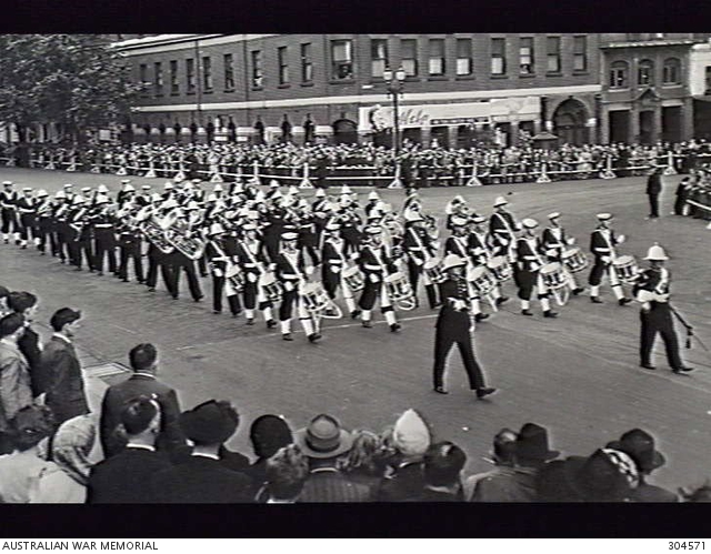 MELBOURNE, VIC. 1950-10-21. A RAN BAND ON A TRAFALGAR DAY PARADE, MARCHING PAST THE CORNER OF ...