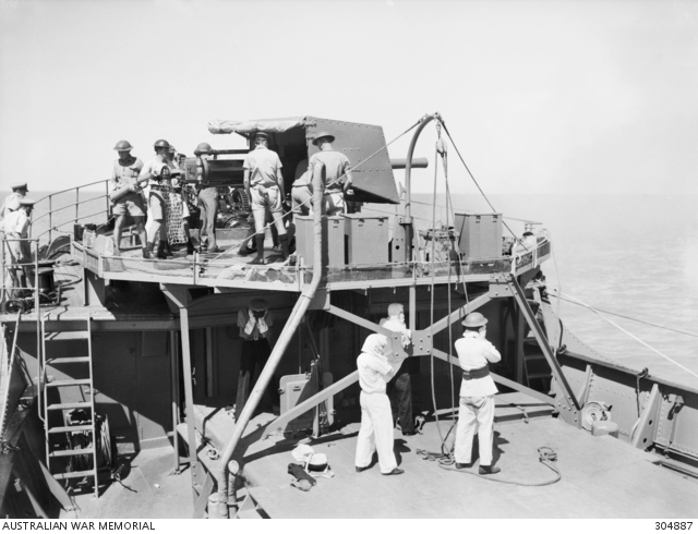 C.1943. PRACTICE FIRING WITH THE 4 INCH GUN ABOARD THE AUXILIARY ANTI ...