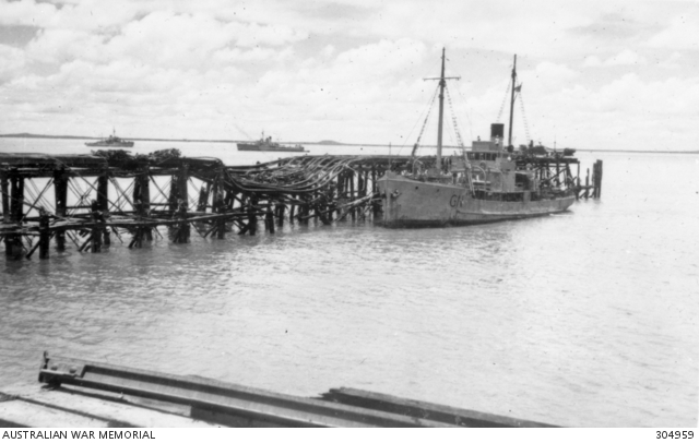 DARWIN, NT. 1942-02-19. THE MAIN PORTION OF THE PIER DAMAGED AND ...